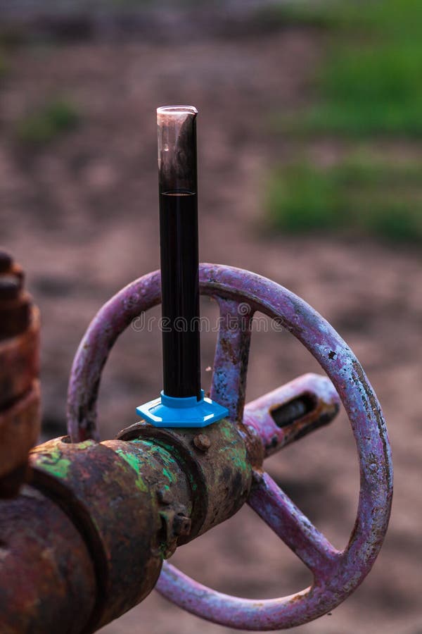Oil Sample in a Test Tube on an Oil Pump Stock Image - Image of ...