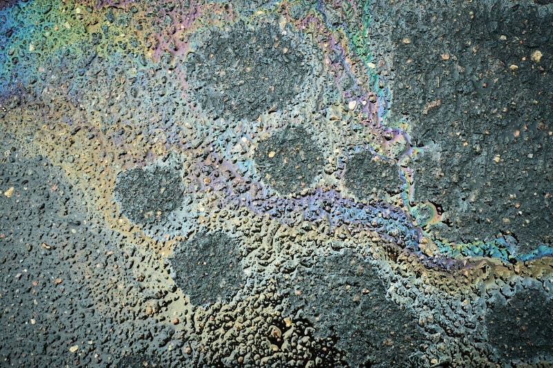 Oil Slick Creates Colorful Patterns on Asphalt after Recent Rain. Stock ...