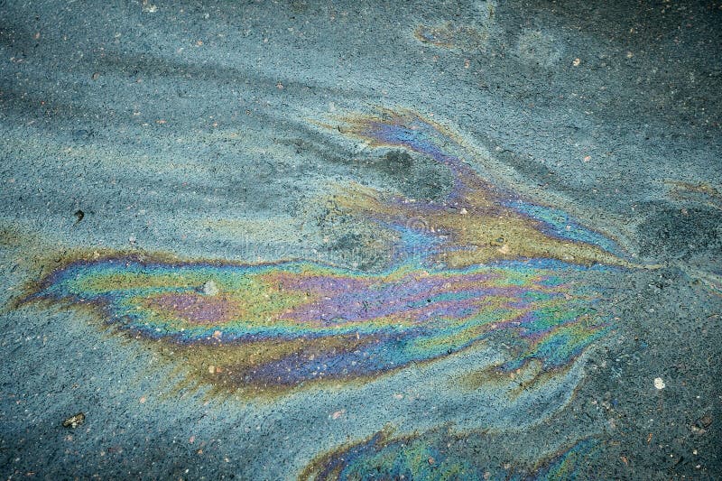 Oil Slick Creates Colorful Patterns on Asphalt Surface after Rain in ...