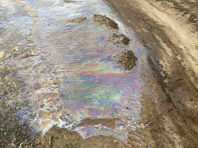 Oil spills on the sand stock photo. Image of offshore - 220401912
