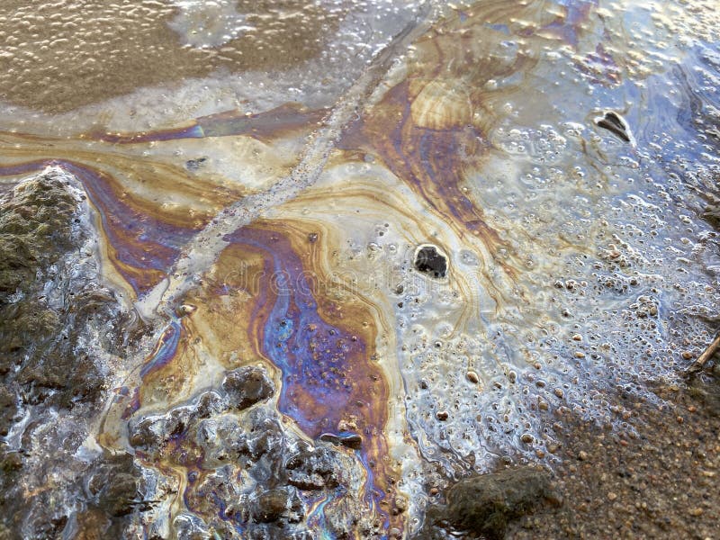 Oil spills on the sand stock image. Image of environmental - 220402337
