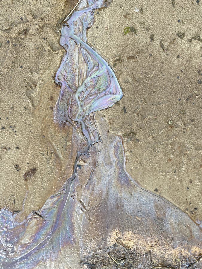 Oil spills on the sand stock image. Image of stain, petroleum - 220402579