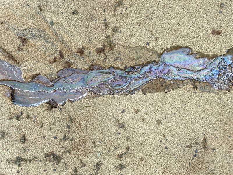 Oil spills on the sand stock image. Image of stain, offshore - 220402589