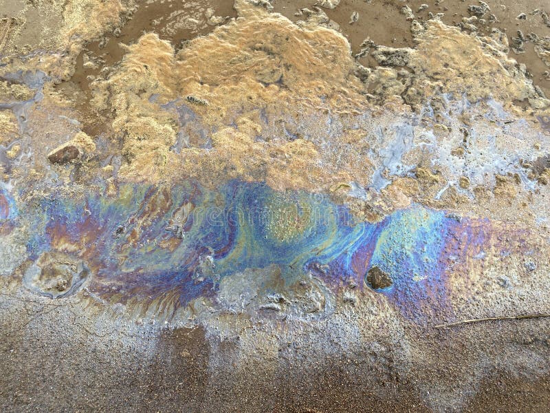Oil spills on the sand stock image. Image of blob, mess - 220402237