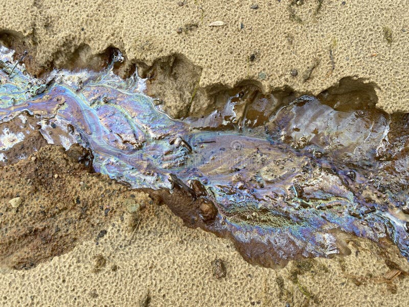 Oil spills on the sand stock image. Image of cleanup - 220402767