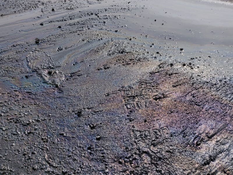 Oil stain on the ground stock photo. Image of road, color - 151210076
