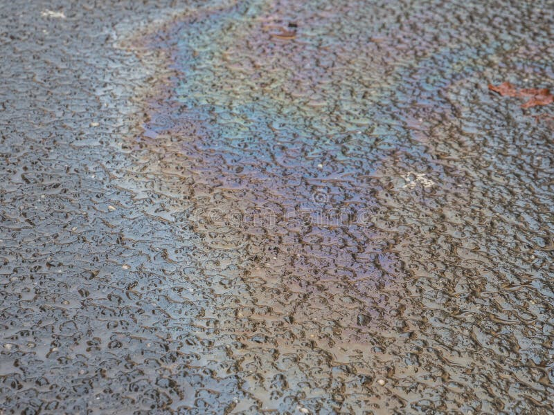 Oil stain on the road stock image. Image of road, parking - 193962345