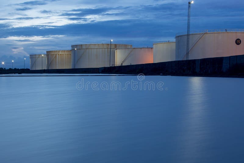 Oil Storage Tanks with Blue Sky and Clouds Stock Photo - Image of power ...