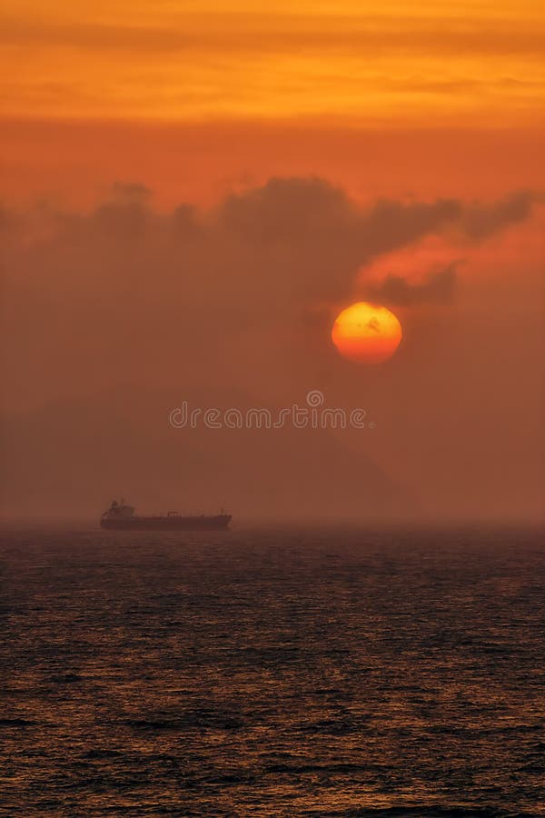 Oil tanker ship at sunset stock photo. Image of orange - 77502176