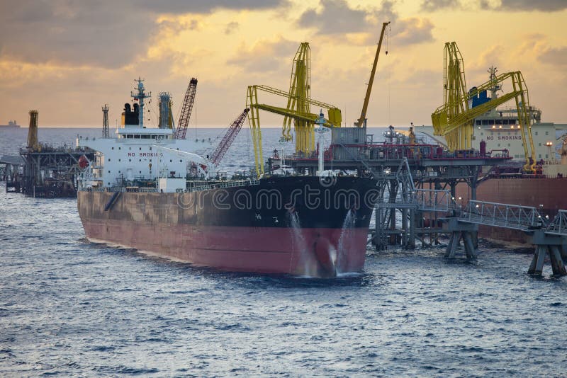 Oil tankers unloading stock photo. Image of freight, orange - 30061568