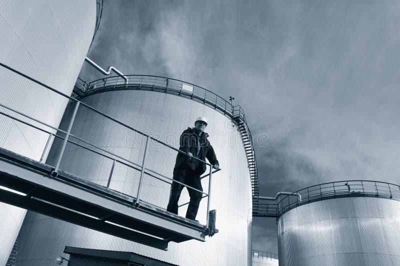 Oil tanks and engineer stock photo. Image of chemical - 3557556