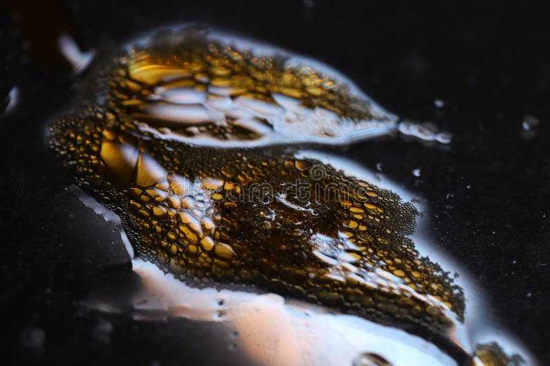Oil Texture in the water stock image. Image of brandy - 319581815