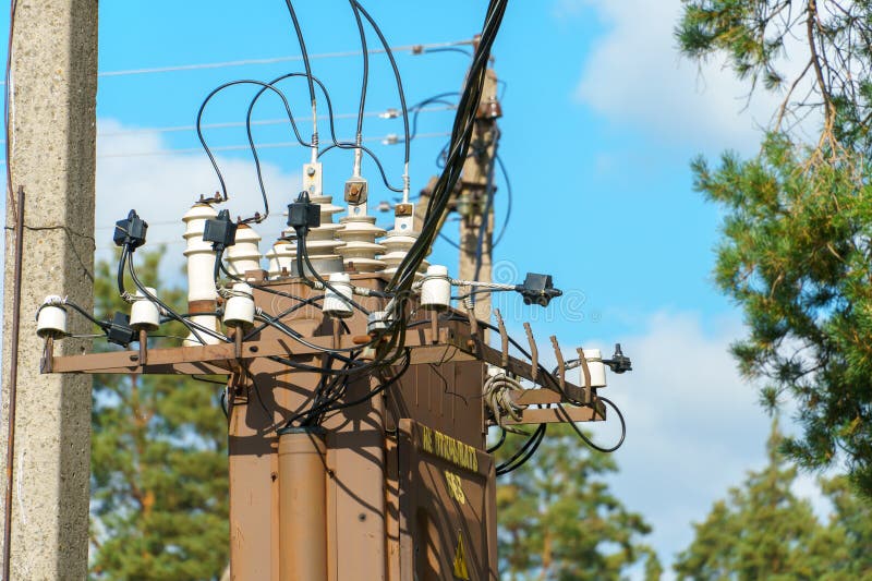 An Oil Transformer and Power Lines in the Forest. the Support of an ...