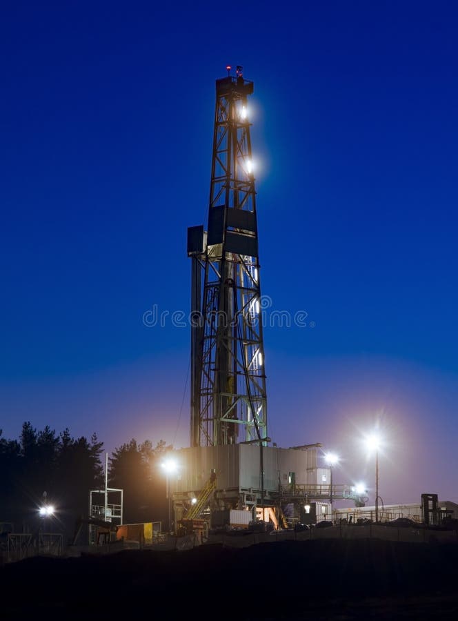 Oil well at night stock image. Image of equipment, platform - 145878467