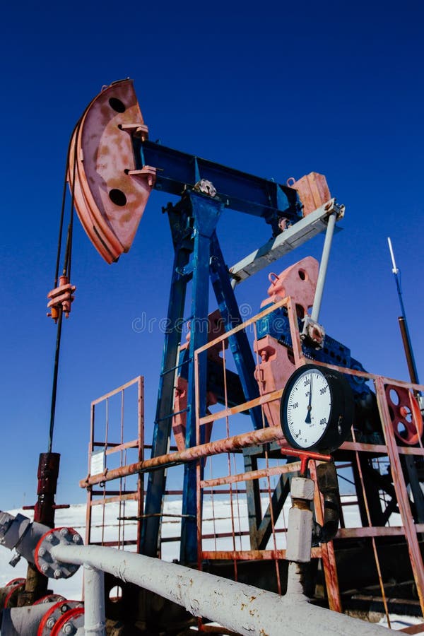 Oil Well with Oil Pump in Winter Sunny Day Stock Photo - Image of ...