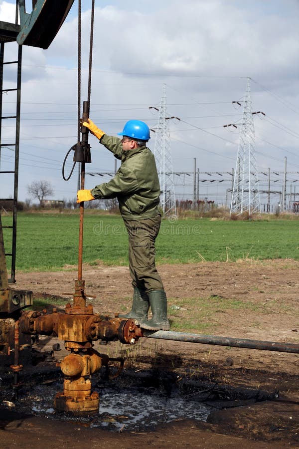 Drilling Rig and Two Oil Workers Stock Image - Image of hardwork, glove ...