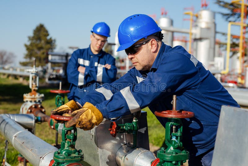 Oil Worker Turning Valve on Oil Rig Stock Image - Image of outdoors ...