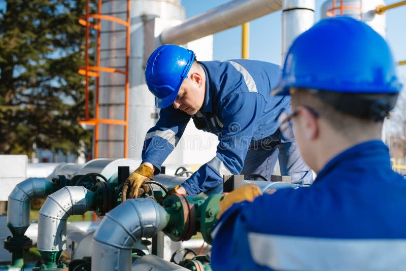 Oil Worker Turning Valve on Oil Rig Stock Photo - Image of outdoors ...