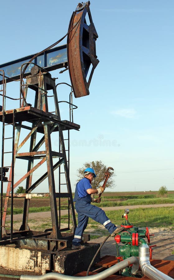 Oil Worker Standing at Pump Jack Stock Image - Image of power, industry ...