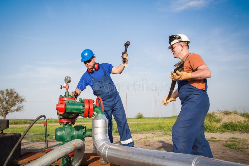 Oil workers stock photo. Image of storage, industry, hard - 30984608