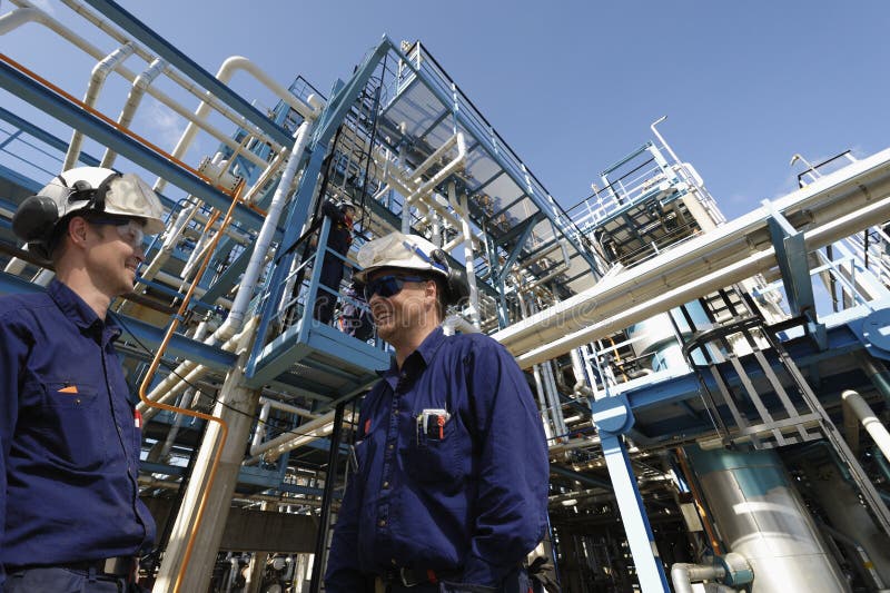 Refinery Workers and Pipeline Station Stock Image - Image of pipes ...