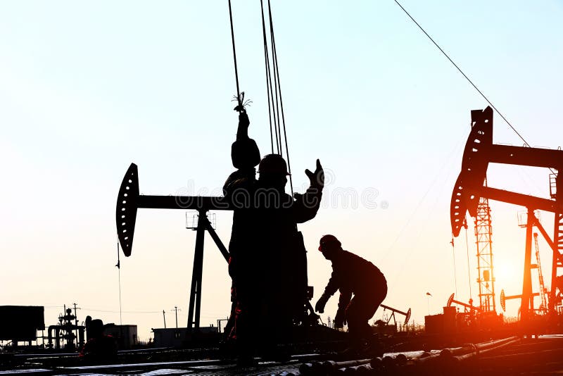 The oil workers at work stock image. Image of gasoline - 220439927