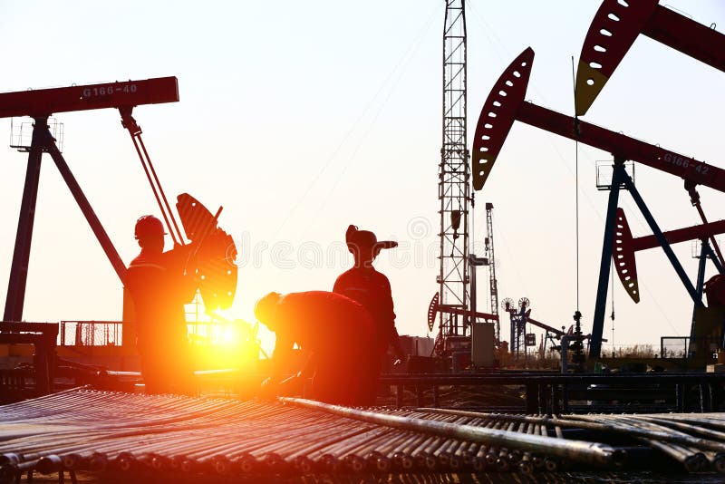 The oil workers at work stock image. Image of resources - 220439951