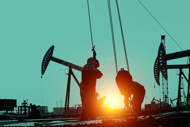 The oil workers at work stock photo. Image of manufacturing - 220440488