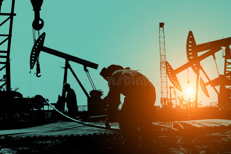 The oil workers at work stock photo. Image of industrial - 220440508