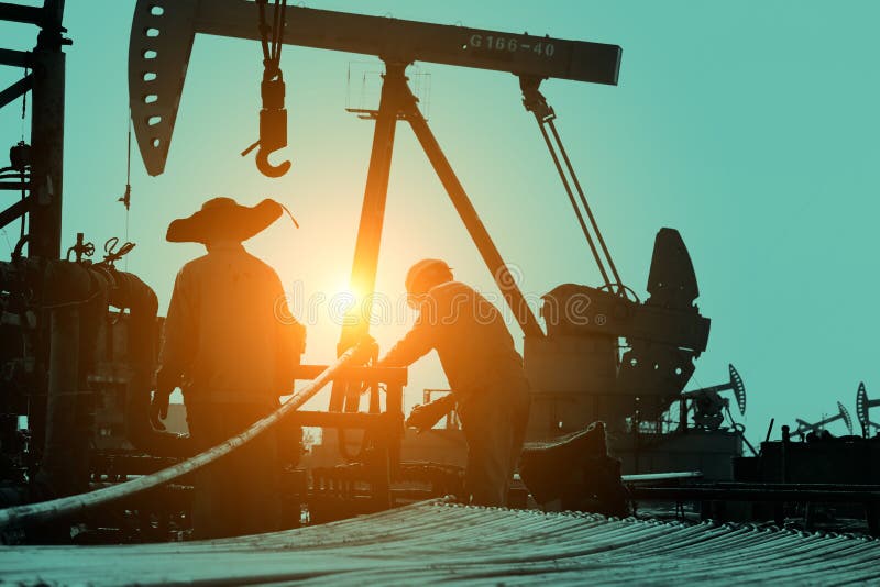 The oil workers at work editorial photography. Image of drilling ...