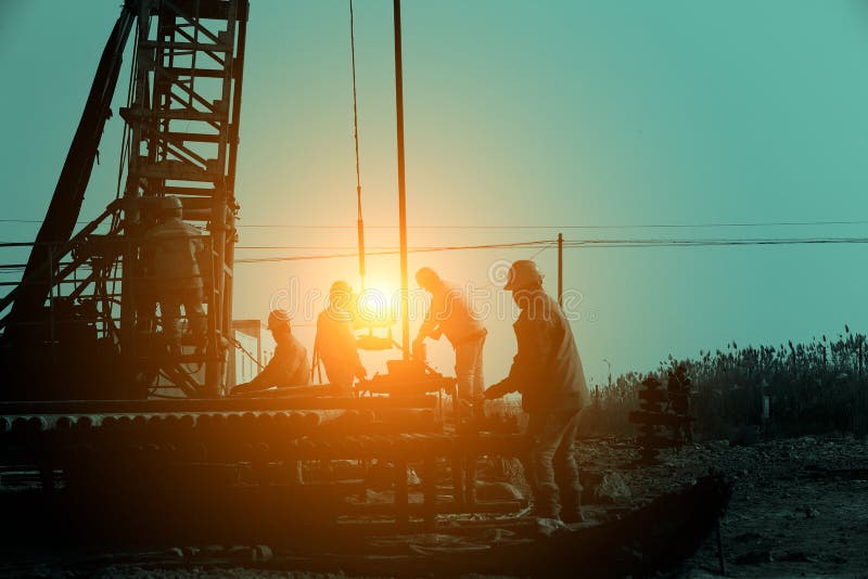The oil workers at work stock photo. Image of view, extraction - 220440532