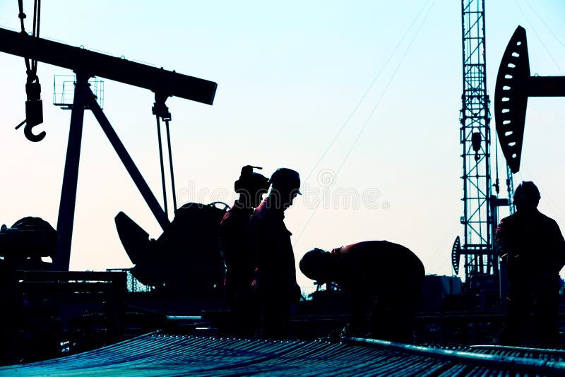 The oil workers at work stock photo. Image of pump, outdoor - 237354102