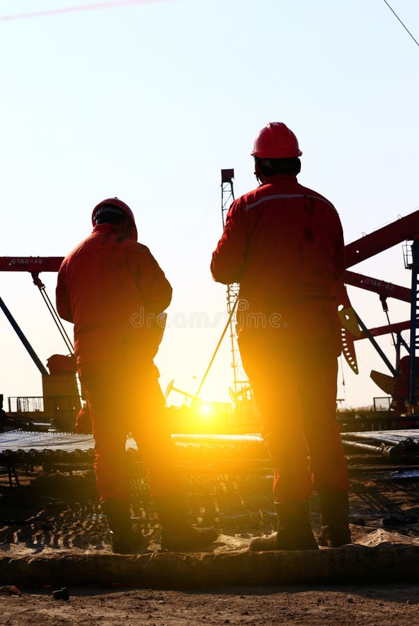 The oil workers at work stock photo. Image of exploration - 306978454