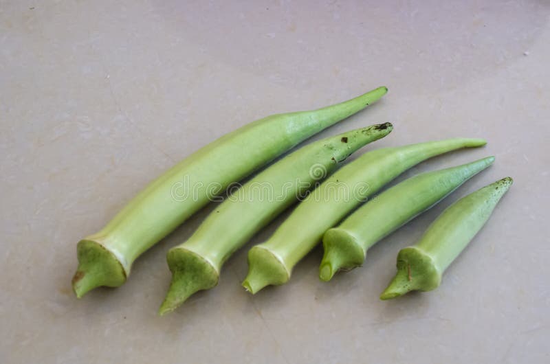 Okras on White Surface stock image. Image of agriculture - 276544549