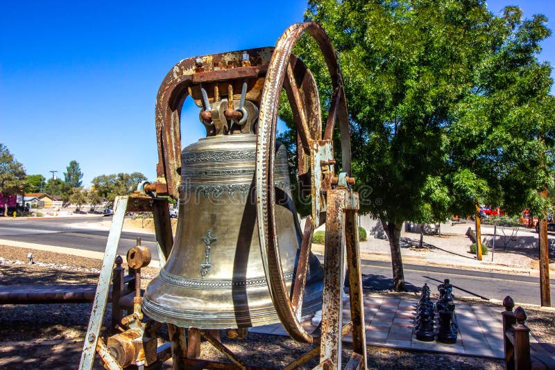Old Bell with Wheel on Display Editorial Photo - Image of chess, green ...