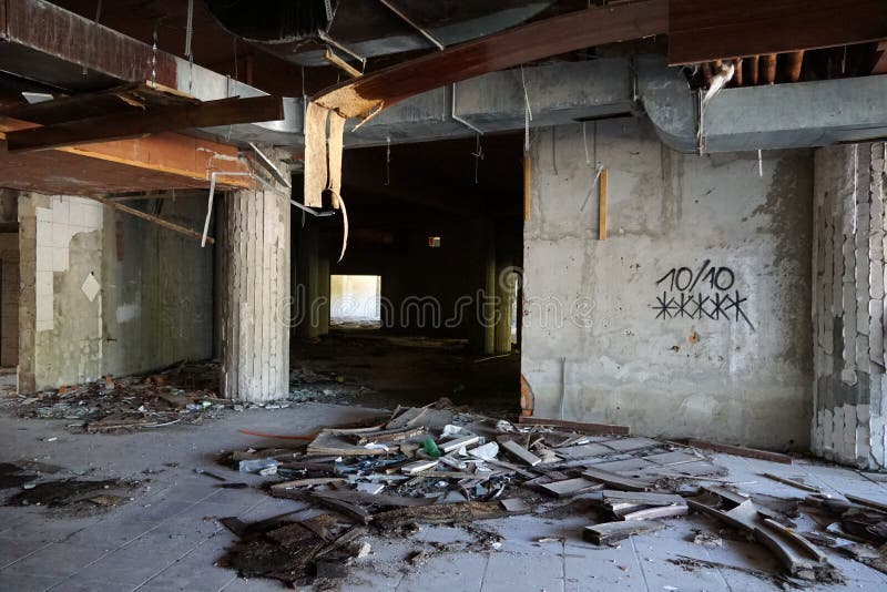 Old Abandoned Building Interior with Broken Ceiling and Woods on the ...