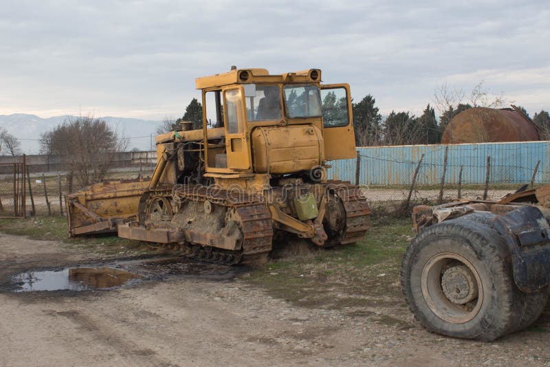 Old Abandoned Bulldozer. Old Rusty and Weathered Bulldozers Stock Photo ...