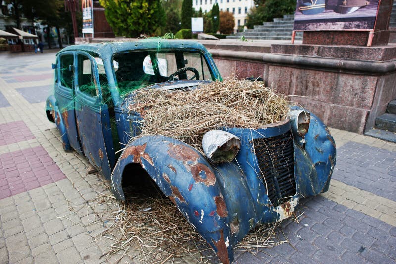 Old Abandoned Car with Hay on Engine Stock Image - Image of rust, town ...