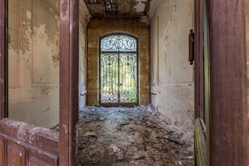 Old Abandoned Decayed Building with a Vintage Door Stock Photo - Image ...
