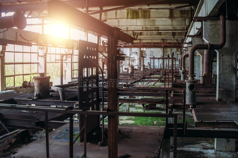 Old Abandoned Factory with Rusty Remains of Industrial Machinery in ...