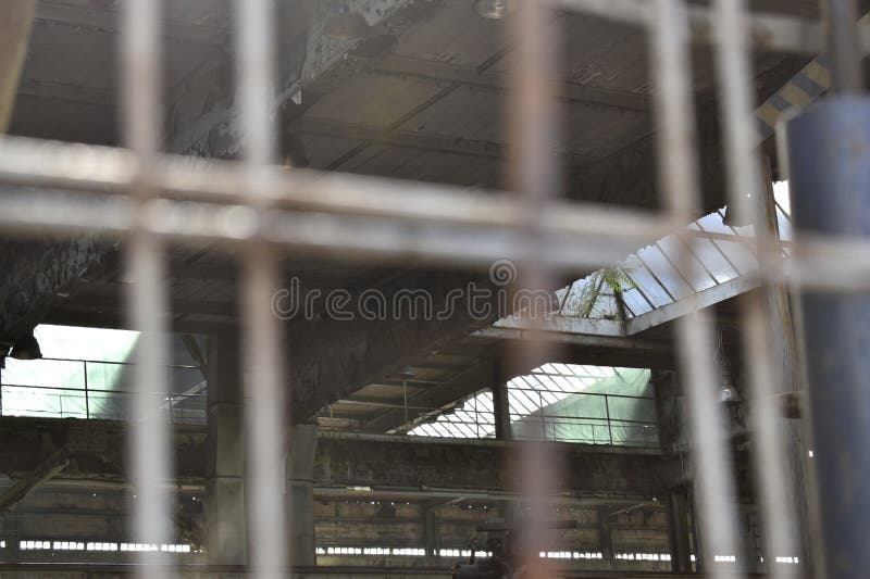 An Old Abandoned Factory through the Window with Grid Stock Photo ...