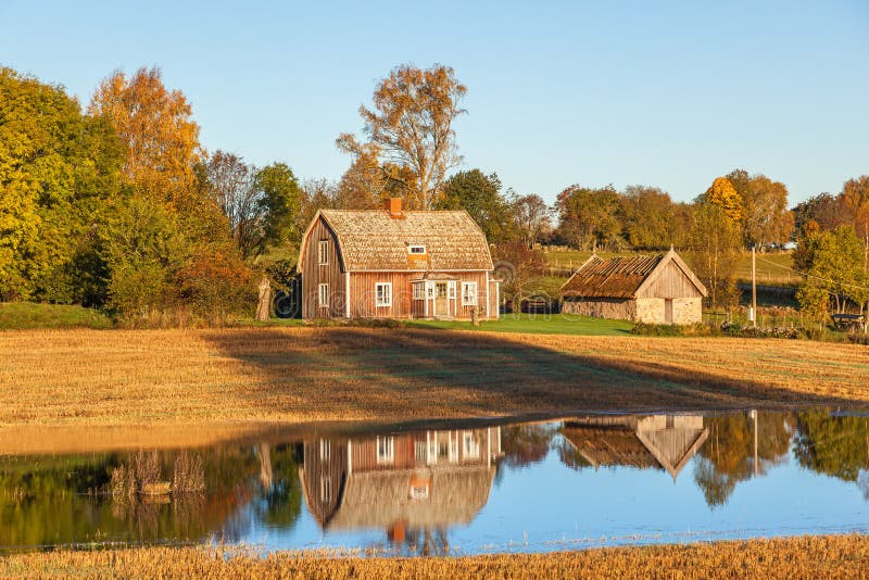 Old Abandoned Farmhouse with Reflections in the Water at the Field ...