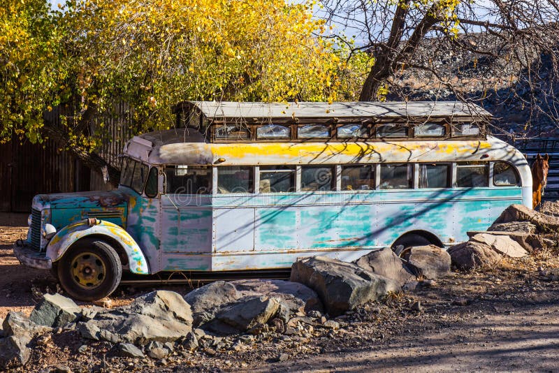 Old Abandoned Converted School Bus in Salvage Yard Stock Photo - Image ...
