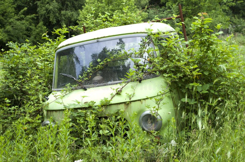 Old Abandoned Overgrown Car Stock Image - Image of cabin, green: 54955809
