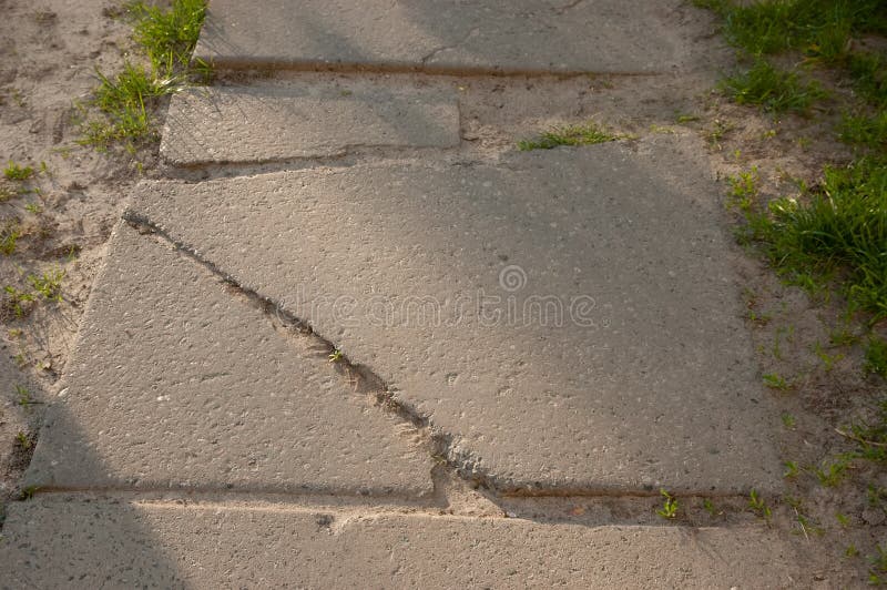 Old Abandoned Path of Broken Tiles, the Grass is Breaking through Stock ...
