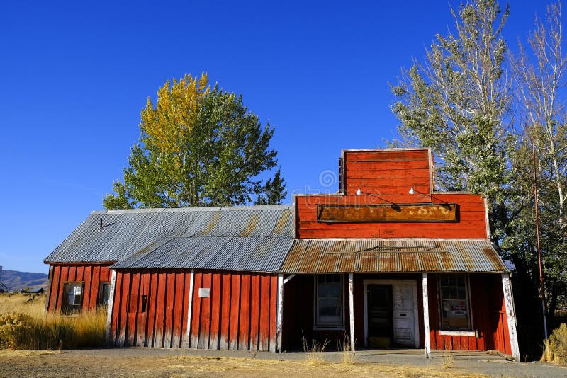 Old Abandoned Red Store Storefront with Blue Sky and Trees Stock Photo ...