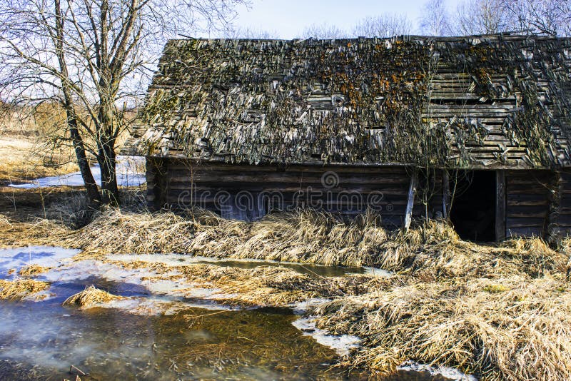 Old Abandoned Wooden House by the River in Spring Stock Image - Image ...