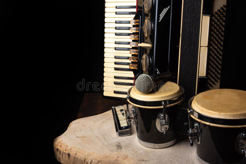 Old Accordion, Harmonica, Bong and Microphone on a Rustic Wooden ...