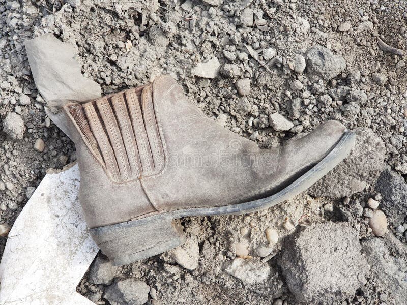 Old Aged Boot Left on the Ground Stock Photo - Image of debris, boots ...