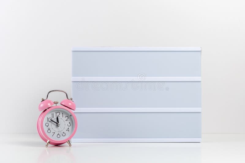 Old Alarm Clock with Empty Lightbox on White Table. Mockup Concept ...